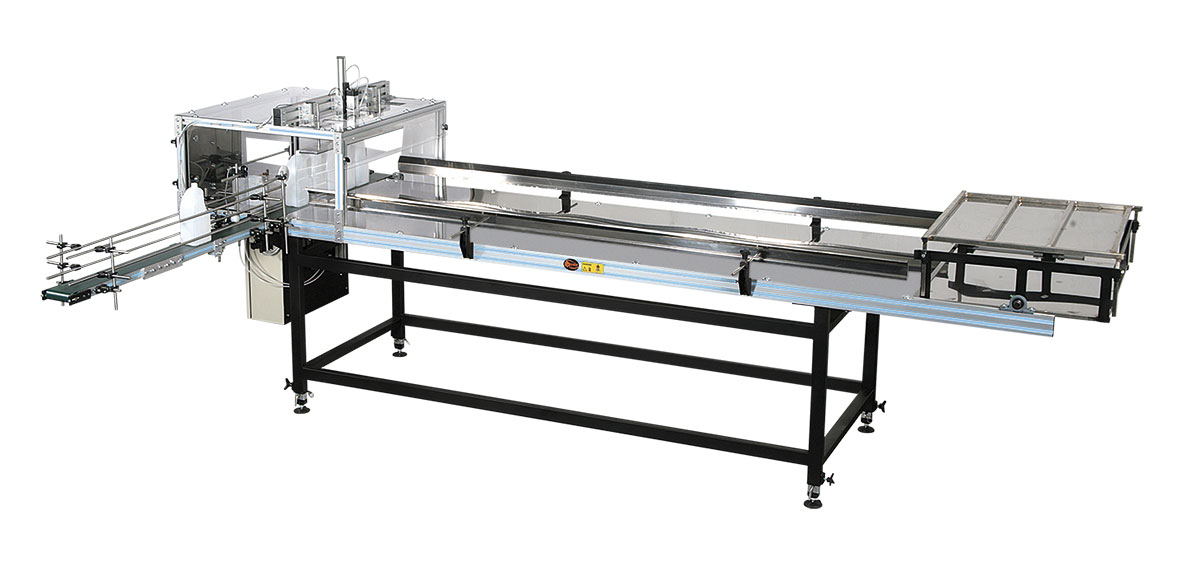 Automated system for positioning bottles in rows, which the operator ...